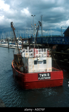 Fishing boat inshore trawler leaving Mallaig fishing port harbour on ...
