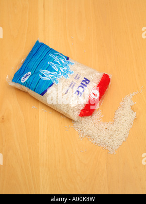 Bag of Long Grain Rice with Some Spilling Out Stock Photo - Alamy