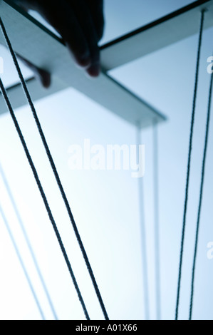 Hand on puppet strings Stock Photo - Alamy