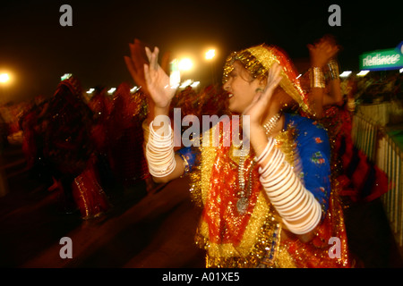 Women clapping hands folk dance called kummi during Pongal celebration ...