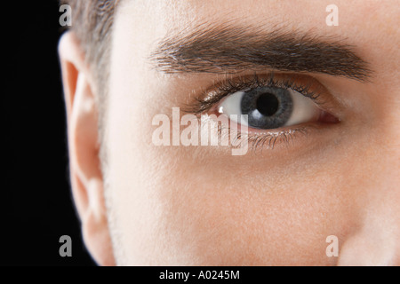 Close up of a serious man's eye looking intensely Stock Photo - Alamy