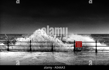 Danger from heavy seas sign, North Bay Beach, Scarborough, UK Stock ...