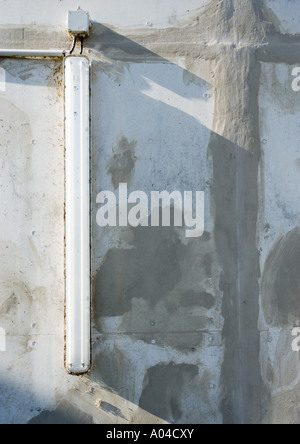 Fluorescent light on concrete wall Stock Photo - Alamy