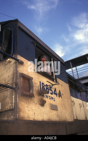 An engine driver of a train in India Stock Photo - Alamy