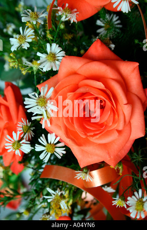 A red rose forms a part of a bouquet Stock Photo - Alamy