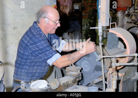 Craftsman Turning a Piece of Slate on Lathe Inside Workshop Inigo Jones ...