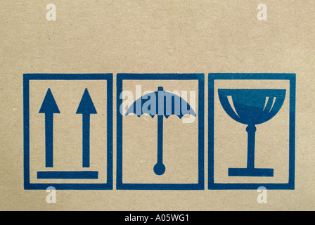 Handling instructions on the side of a cardboard box Stock Photo - Alamy