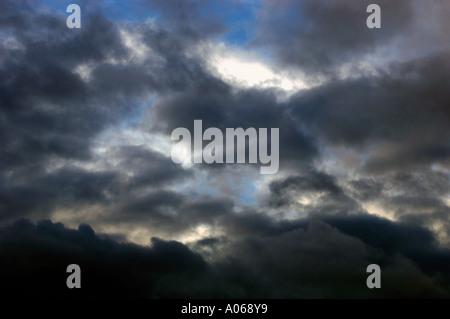 Storm clouds contrasting with blue sky during rapidly changing weather ...