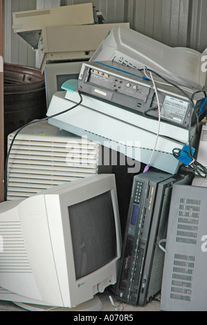 old computers behind thrift store with sign about not stealing items ...