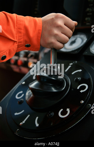 Graphic shot of Tugboat captain using controls whilst manoevering by ...
