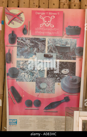Poster warning of landmine dangers in Thailand village Stock Photo - Alamy