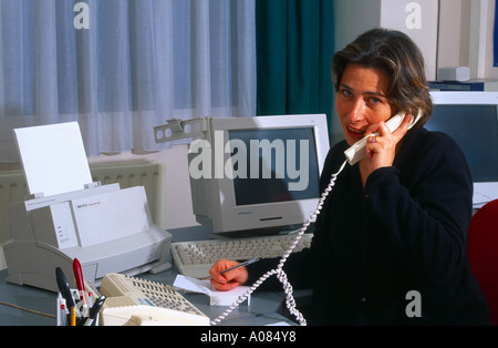 Telephone operator working at switchboard Stock Photo - Alamy