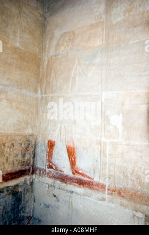 Tourists study ancient inscriptions inside a tomb at the Pyramid ...