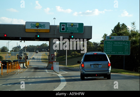 Florida Turnpike highway toll booths with SunPass lanes during the ...