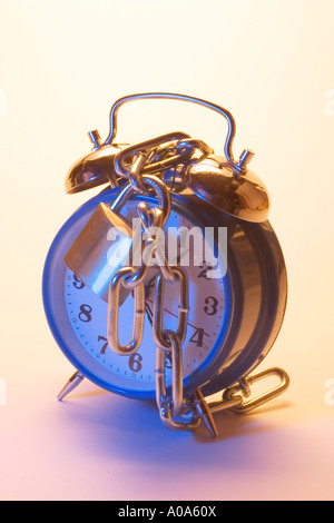 Alarm Clock with Chain and Lock Stock Photo - Alamy