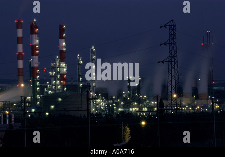 Illuminated chimneys at a petroleum refinery, Berre, France Stock Photo ...