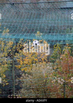 ball stuck on top of net roof in play ground Stock Photo - Alamy