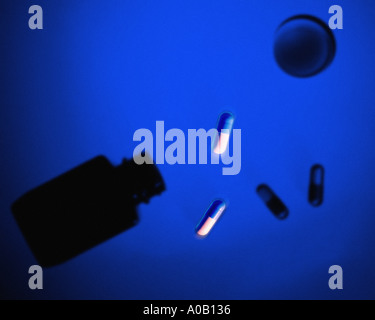 White pills and capsules Stock Photo - Alamy
