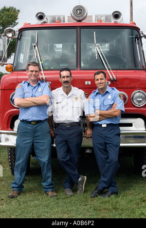 Group of volunteer firemen Stock Photo - Alamy