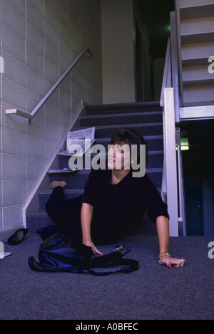 woman falling down stairs Stock Photo - Alamy