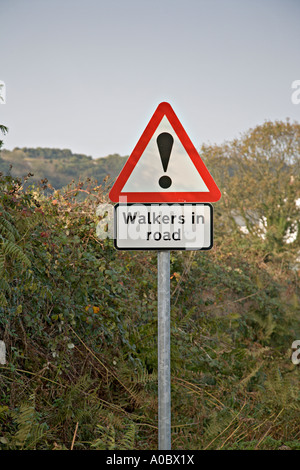 Walkers in road warning sign, The Lake District, Cumbria, England, UK ...