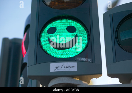 Traffic light on green with smiley face drawn on it. Old Street Stock ...
