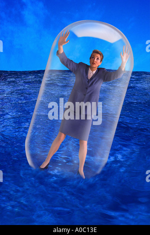 Woman trapped in glass jar Stock Photo - Alamy