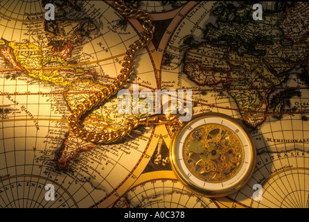 Pocket watch on old map background, vintage style light and tone.Travel ...