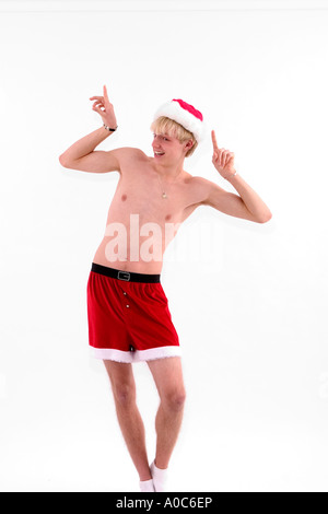 happy man in santa hat and suit at christmas Stock Photo - Alamy
