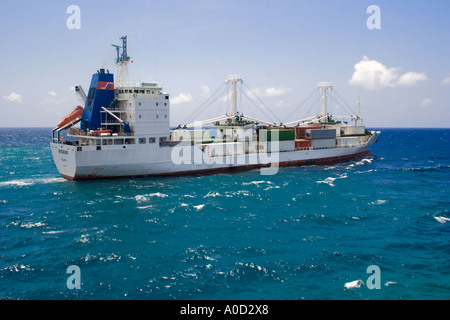 Cargo ships sail in and out of Qingdao Port via the Jiaozhou Bay ...