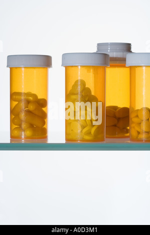 assortment of pharmaceutical drugs with pill bottles in the background ...