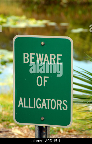 Sign warning visitors of the danger of alligators in nearby water Stock ...