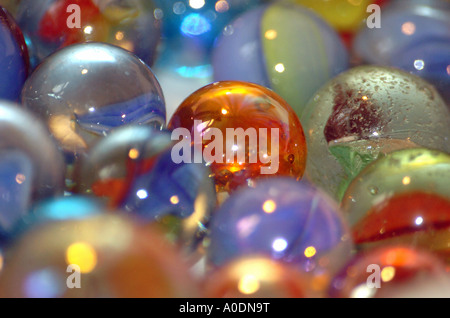 A close up shot reveals the shiny irridescence of individual marbles ...