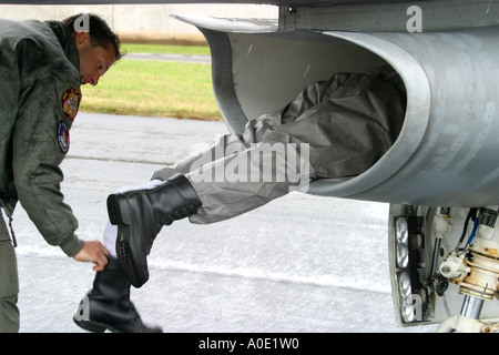 Pilot inspecting jet air intake on F16 fighter plane Stock Photo - Alamy