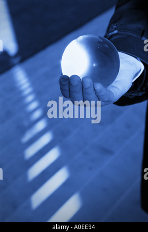 man holding crystal ball Stock Photo - Alamy