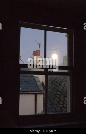 Full moon through window Stock Photo - Alamy