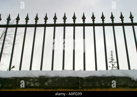 Spikes on top of a metal railing fence in an English town Stock Photo ...