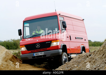 red mercedes 4x4 van travelling off road on difficult terrain Stock ...