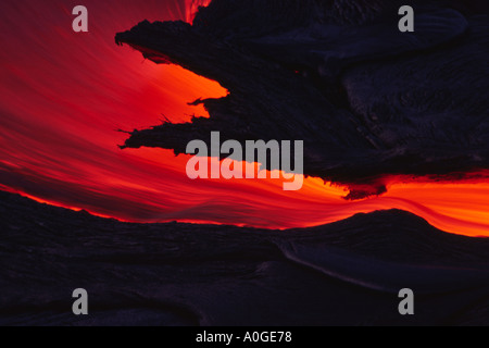 Large tube breakout sends a stream of lava into the early morning light ...