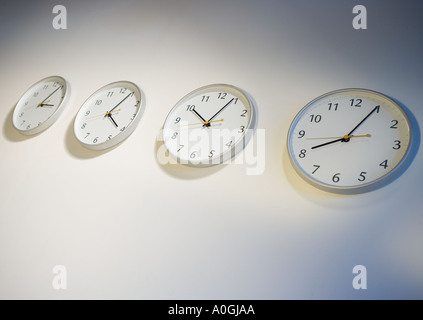 Clocks with time zone of different country on wooden shelves background ...