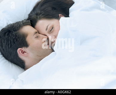A couple snuggled up together Stock Photo - Alamy