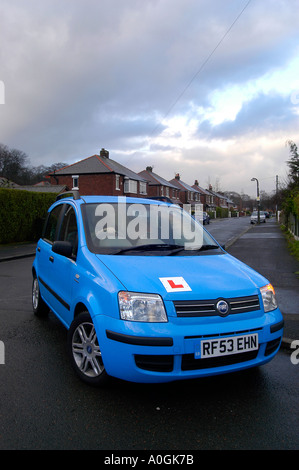 Learner driver driving car with L-plate, view from outside. Driving ...