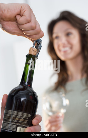Couple holding hands under an opening of a large tree Stock Photo - Alamy