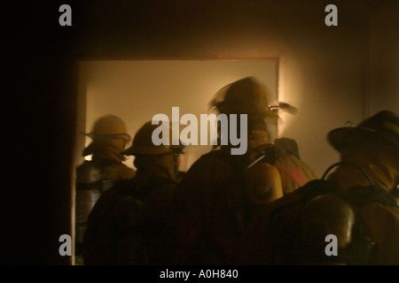 Firefighters inside Burning House Stock Photo - Alamy