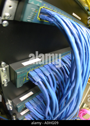 Large network hubs with connected cables Stock Photo - Alamy