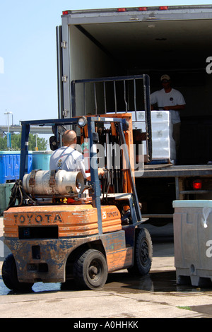 A Forklift truck moving cargo around a factory loading bay in Michigan ...