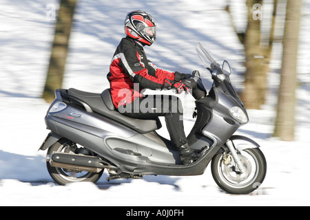 motor cycle scooter covered with snow Stock Photo - Alamy