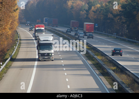 Cars driving on a German autobahn motorway with road signs near Koln in ...