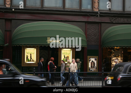 People Walking Past Harrods Store Stock Photo - Alamy