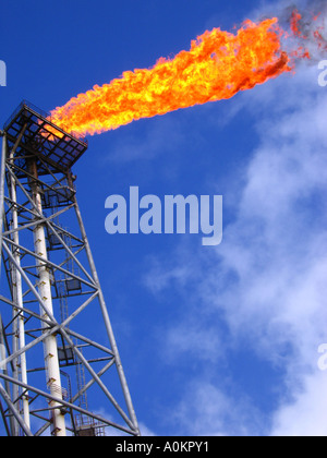 Full frame view of a lit offshore gas flare and column Stock Photo - Alamy